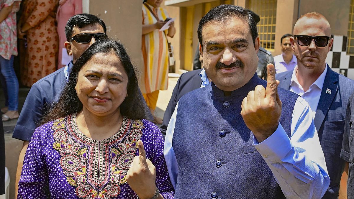 LS polls: Industrialist Gautam Adani, UP guv Anandiben Patel exercise ...