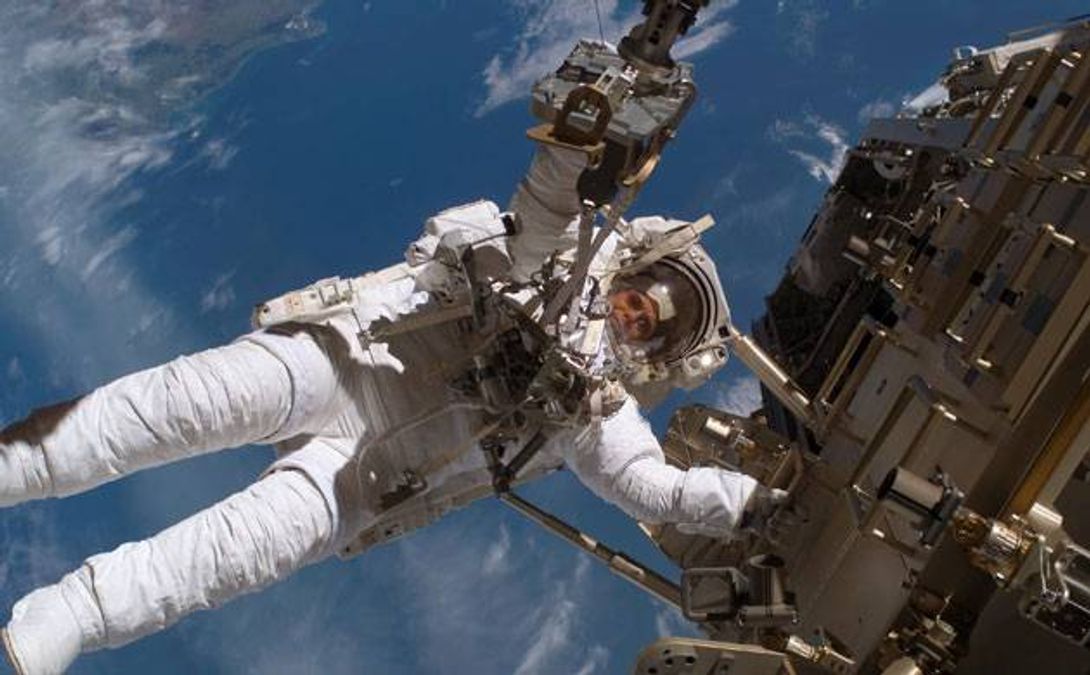 Spacewalking astronaut successfully replaces blurry camera outside ...