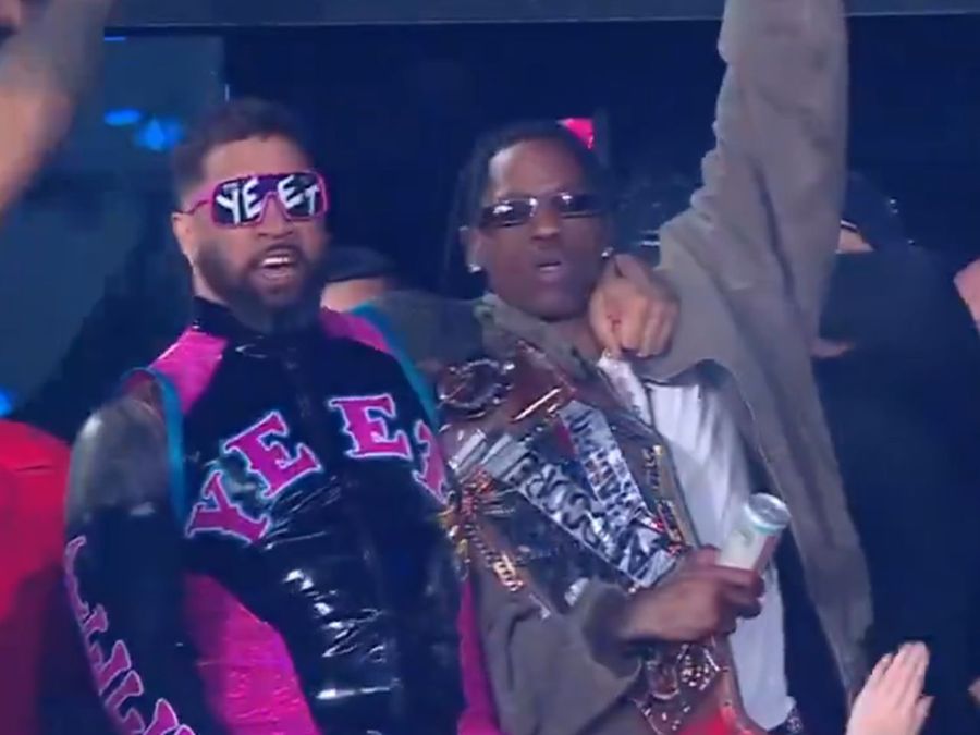 Travis Scott accompanies Jey Uso during his entrance on WWE Raw on Netflix